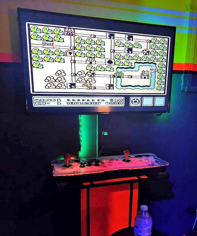 Super Mario's pixelated adventures await on this classic arcade setup, offering a perfect post-hot dog gaming challenge.