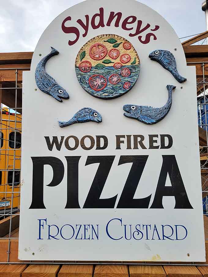 When your signage features whimsical fish swimming around a pizza, you know this place doesn't take itself too seriously but takes flavor very seriously.