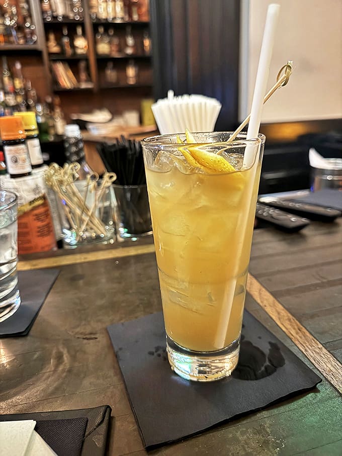 A cocktail tall enough to have its own zip code, delivering refreshment with the precision of a liquid mathematician.