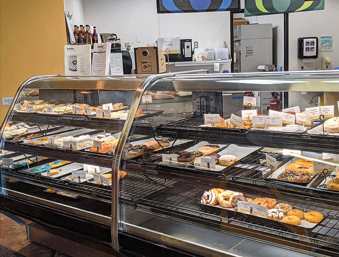 Display cases packed with temptation, organized like a delicious library where every book is made of butter and flour.