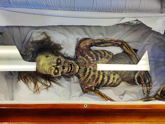 This unfortunate soul in the coffin serves as a reminder that Terror Trader takes its commitment to authenticity seriously.