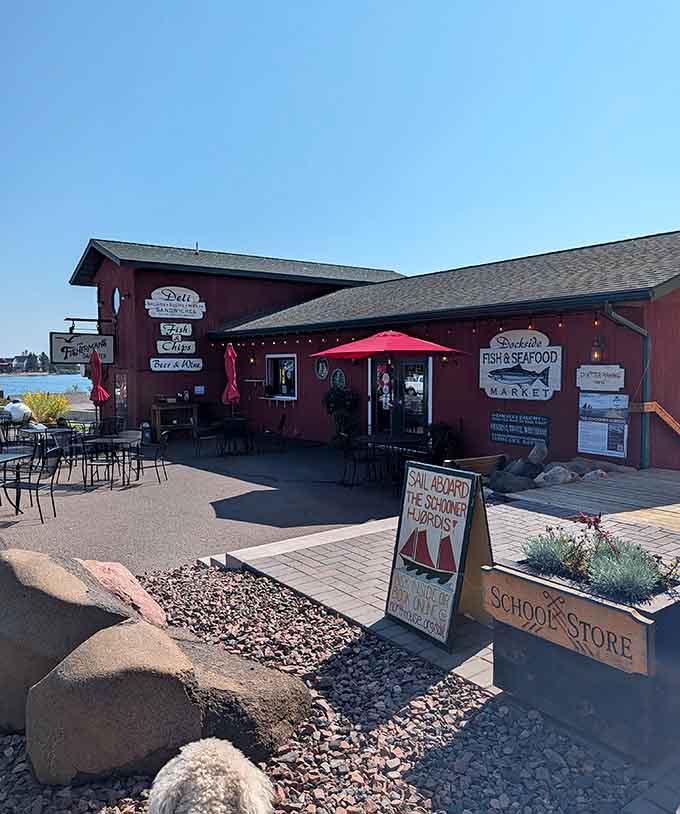 The waterfront location offers unbeatable harbor views where boats bob gently and Lake Superior stretches endlessly toward the horizon.