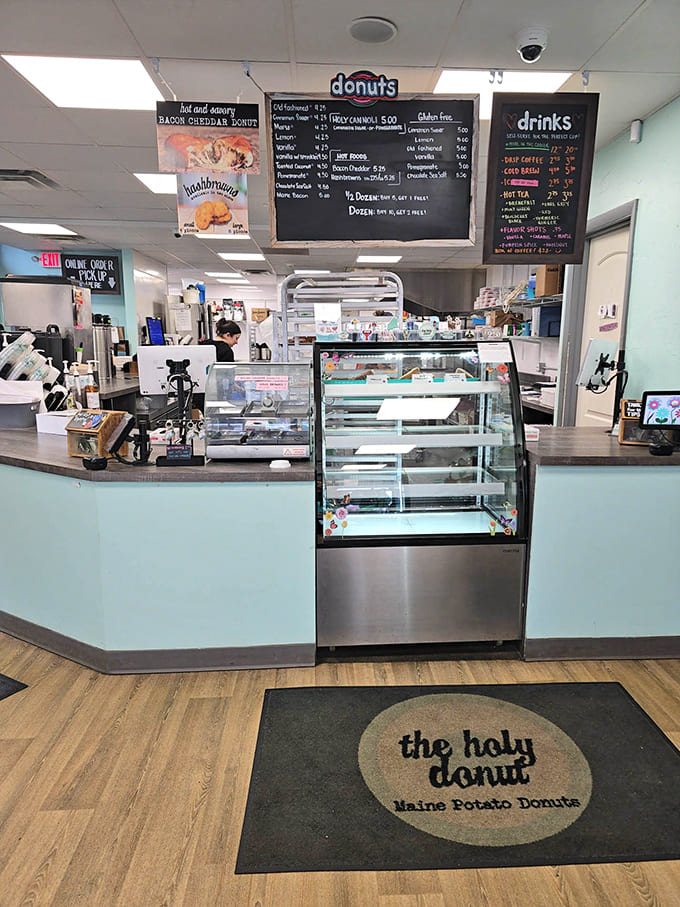 The counter setup makes ordering efficient while that floor mat reminds you exactly where your priorities should be.