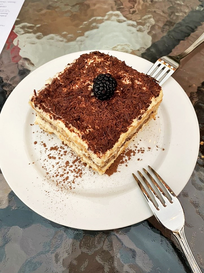 Layer upon layer of coffee-soaked bliss. This tiramisu is so light and airy, it's like eating a cloud that's been dipped in espresso and dusted with cocoa.