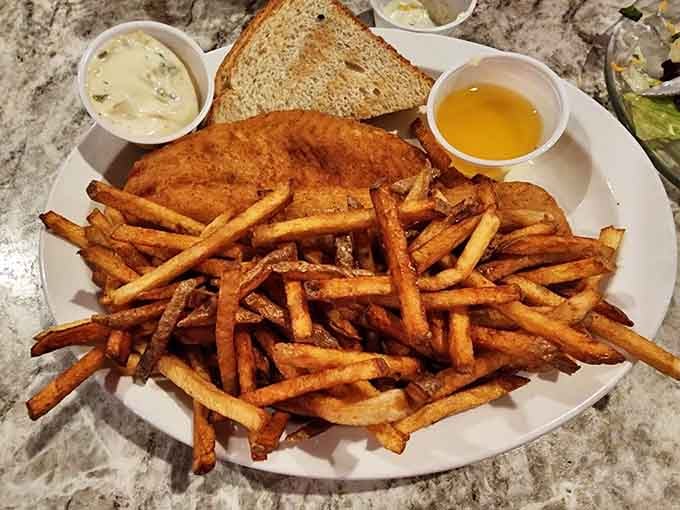 Perfectly fried fish with a generous pile of fries and all the fixings makes for a satisfying meal any day.
