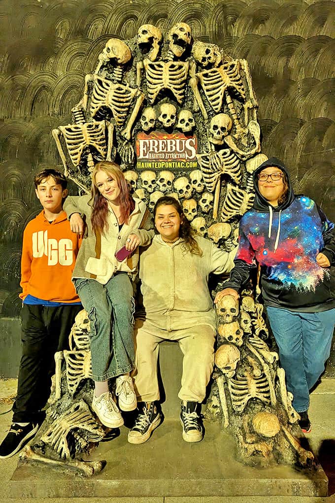 Tourists: Brave visitors pose with skeletal remains, creating memories that will last longer than their peaceful sleep tonight.