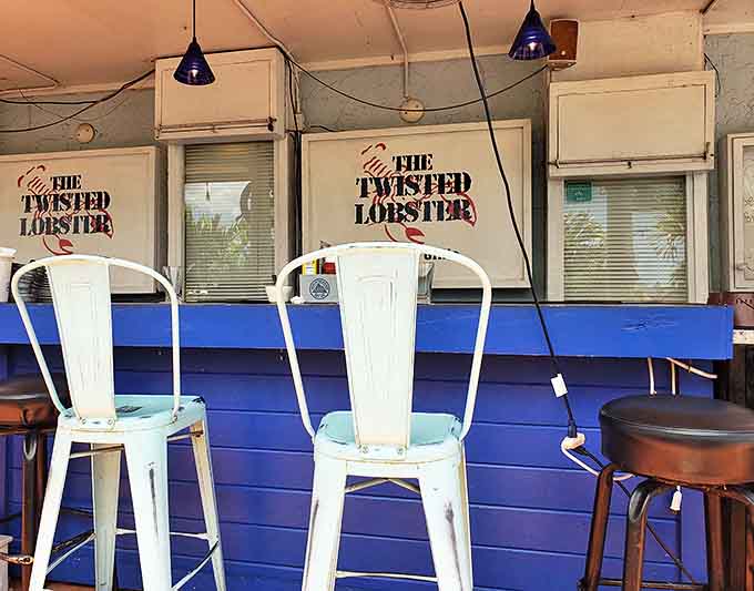 Counter seating offers a front-row view of the action. The blue and white color scheme continues the coastal theme while creating a bright, welcoming space.