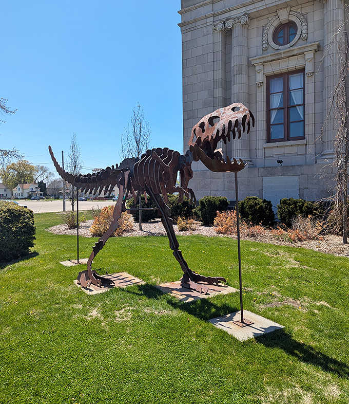 Visitors stand humbled beneath towering skeletons, experiencing the awe-inspiring scale of creatures that dominated Earth for millions of years.
