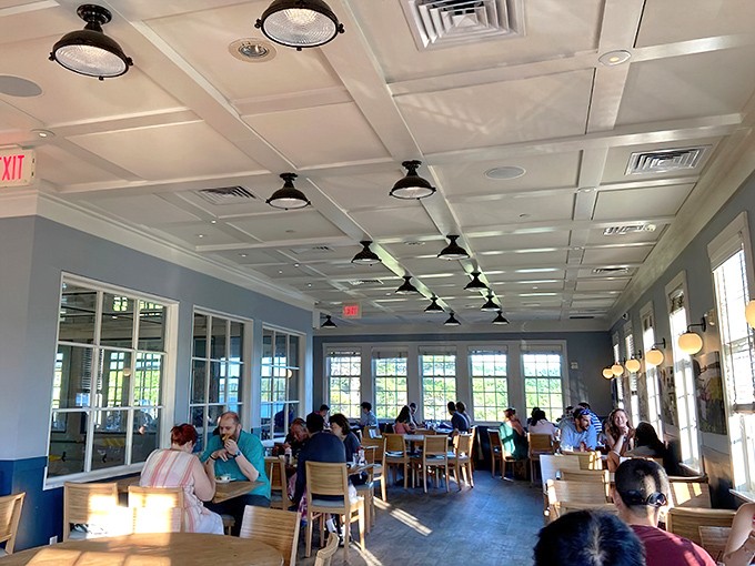 Sunlight floods the upstairs dining room, creating a bright, airy space where every table feels like the best seat in the house.