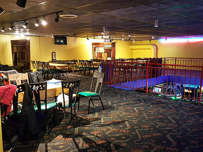 The upstairs dining area offers the perfect vantage point for plotting your next family competition while enjoying surprisingly good eats.