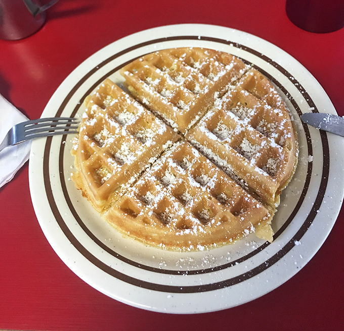 Belgian waffle perfection &ndash; crisp exterior, fluffy interior, and just waiting for that maple syrup waterfall to complete the breakfast fantasy.