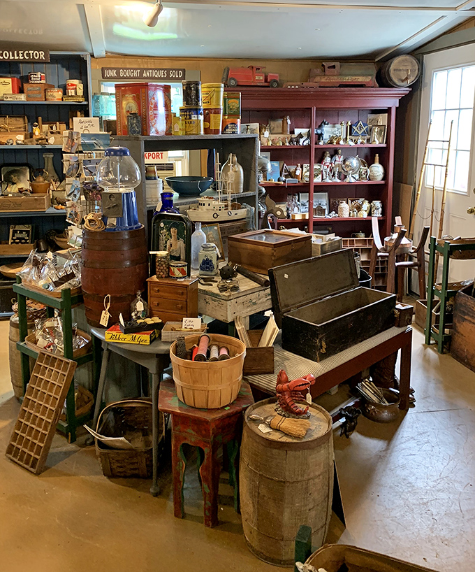 Every surface tells a story in this corner packed with nautical artifacts, vintage barrels, and the kind of authentic clutter that designers try to replicate.