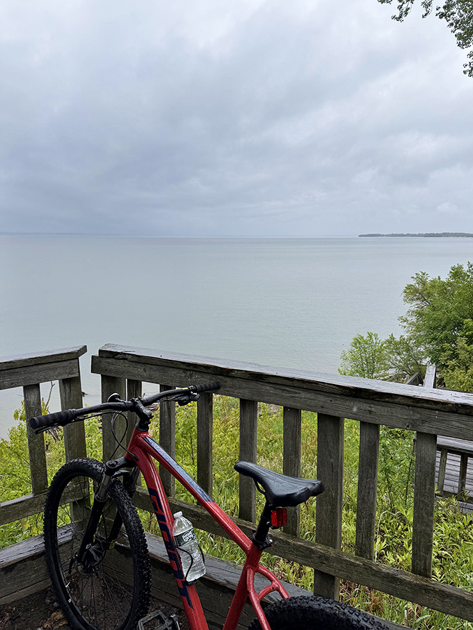 Wooden overlook decks provide strategic resting spots where trail users can absorb panoramic views of the Adirondacks across the water.
