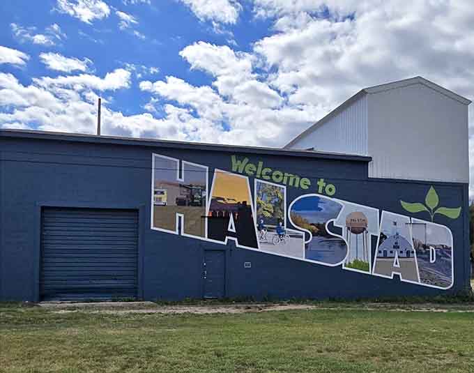 This colorful welcome mural spells out HALSTAD in letters filled with local imagery, giving visitors a warm greeting and a preview of the small-town charm they're about to experience.