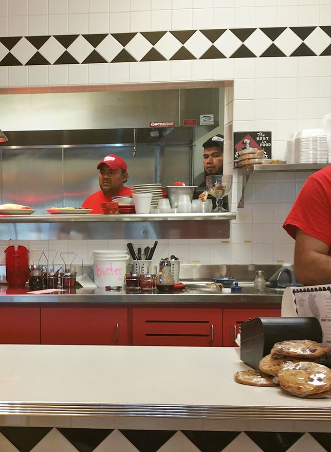 The kitchen crew works with practiced efficiency, turning out order after order while maintaining the quality that keeps people coming back for more.