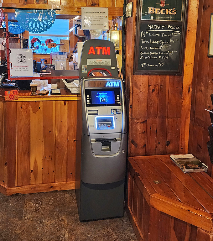 Even the ATM looks at home among the knotty pine walls &ndash; practical necessity meets coastal charm.