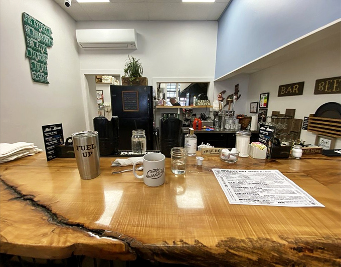 The live-edge wood counter offers front-row seats to the breakfast show, where coffee flows freely and local gossip is served piping hot.