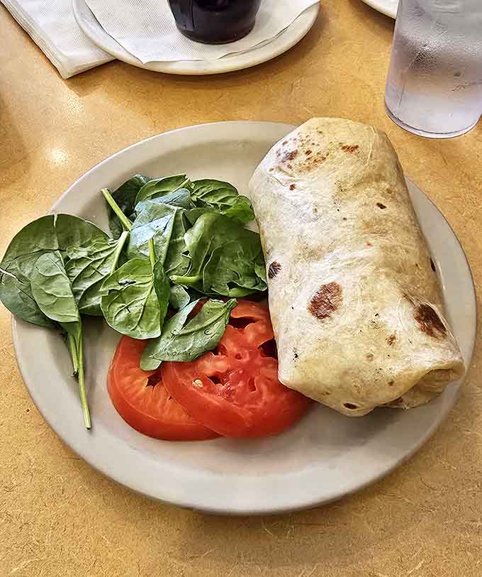 The wet burrito arrives like a colorful sunrise&mdash;cheese-covered landscape with enough filling to sustain you through the longest road trip.