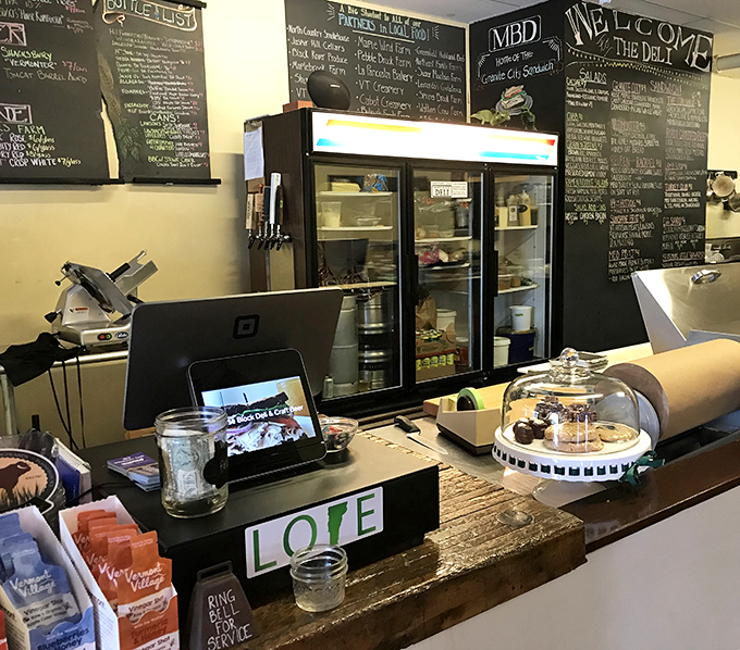 Chalkboard menus and a well-stocked case showcase the day's offerings, while the "LOVE" sign hints at what really goes into each creation.