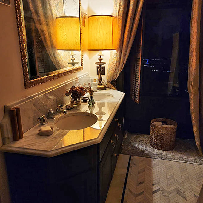 Luxury meets vintage charm in this bathroom, where the clawfoot tub promises deep soaks worthy of the castle's elegant surroundings.