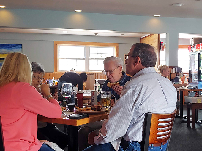 The true measure of a restaurant: tables filled with locals who could eat anywhere but choose to eat here. Those smiles tell the whole story.