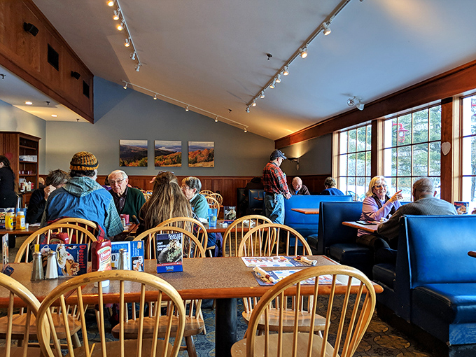 The dining room's warm wood paneling and practical layout speaks to Maine's no-nonsense approach to hospitality &ndash; comfortable without being showy.