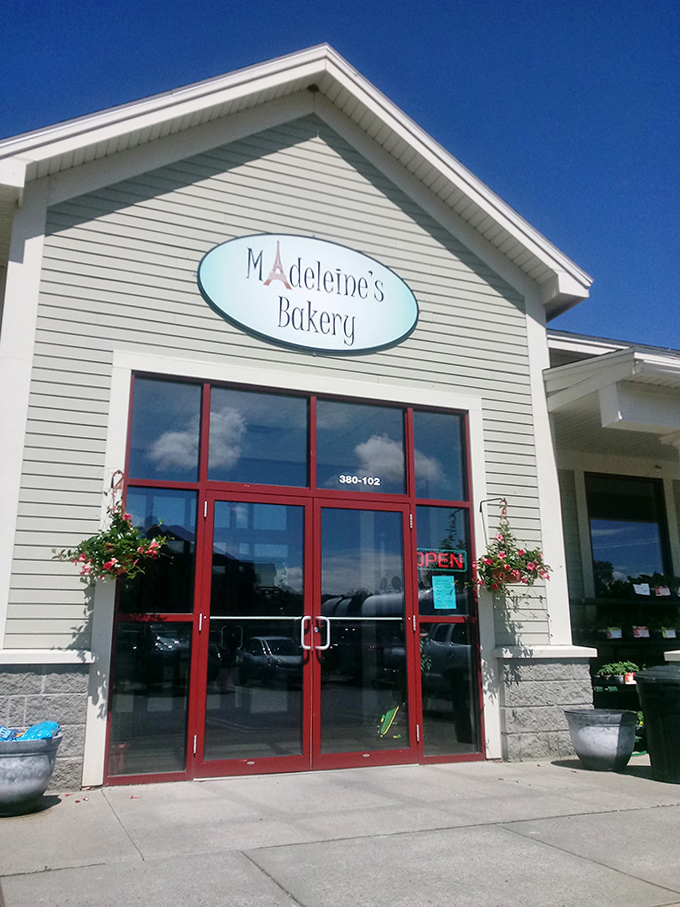 The bakery's exterior on a perfect Vermont day &ndash; where blue skies and sweet treats create memories that last a lifetime.