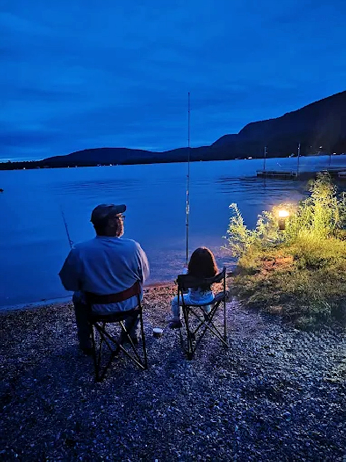 Nighttime fishing at Branbury offers peaceful moments between generations, creating memories that outlast any catch.