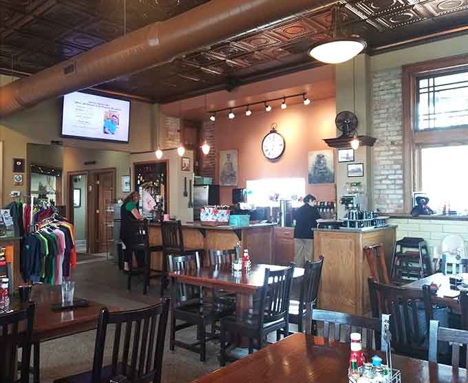 Exposed brick walls and vintage photographs create an ambiance that honors the building's past while serving its present purpose as a community gathering spot.