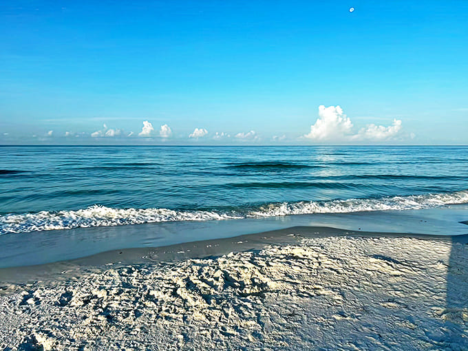 The hypnotic rhythm of gentle waves creates nature's most effective stress reliever along this peaceful coastline.