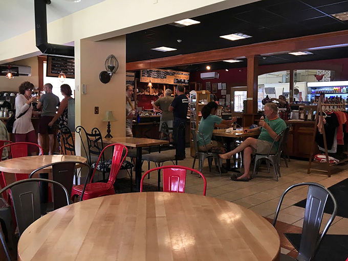 The caf&eacute; space invites lingering, where conversations flow as easily as the coffee and pastry crumbs are badges of honor.