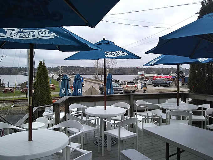 The outdoor seating area offers a peaceful respite where you can savor your seafood treasures while watching boats glide by.
