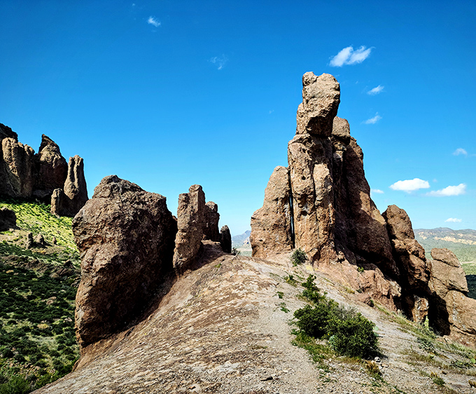 These dramatic stone formations seem to defy gravity, standing like nature's sculptures against the endless desert sky.