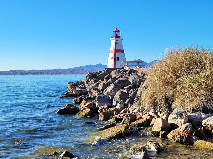 This charming lighthouse stands sentinel on rocky shores, a maritime fantasy somehow perfectly at home in the desert.