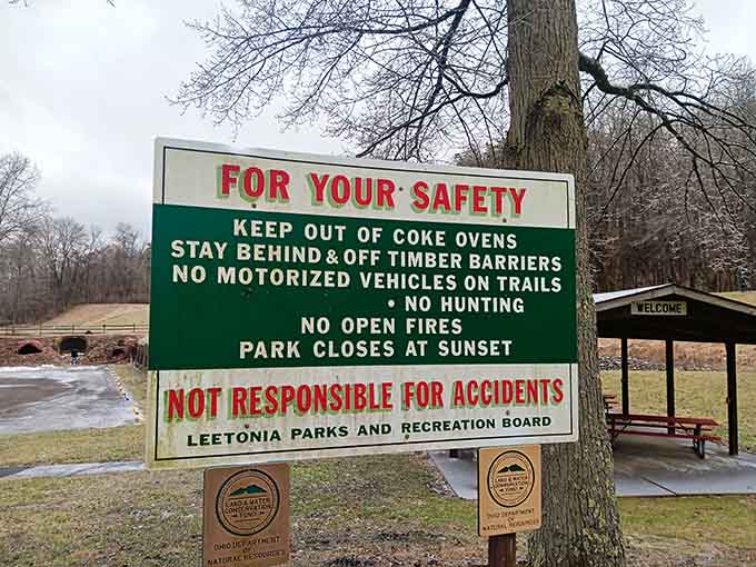 The safety sign reminds visitors that these aren't just pretty ruins but actual historical structures that require respect and caution during exploration.