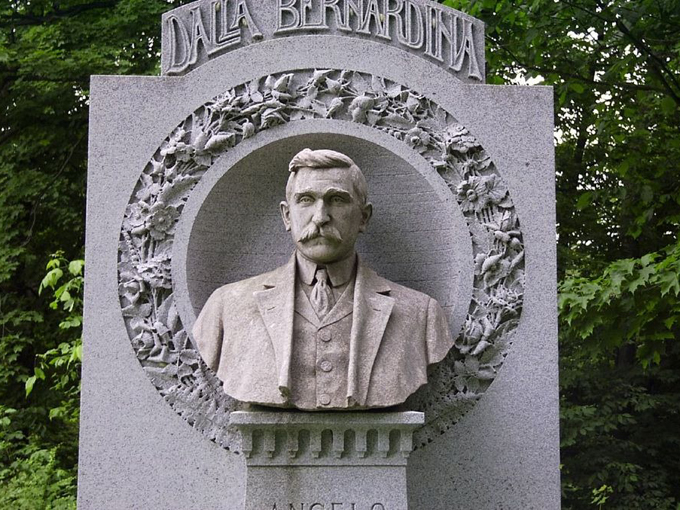 The Dalla Bernardina memorial features an incredibly detailed portrait bust, capturing not just likeness but character in enduring granite.