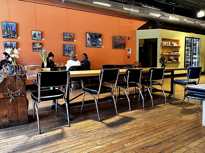 Warm orange walls and community tables create the perfect backdrop for enjoying exceptional food among both friends and soon-to-be friends.