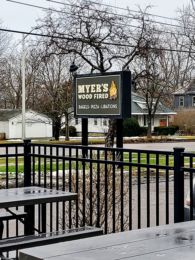 Even in winter, Myer's sign stands as a beacon of warmth, promising wood-fired comfort food to chase away Vermont's notorious chill.