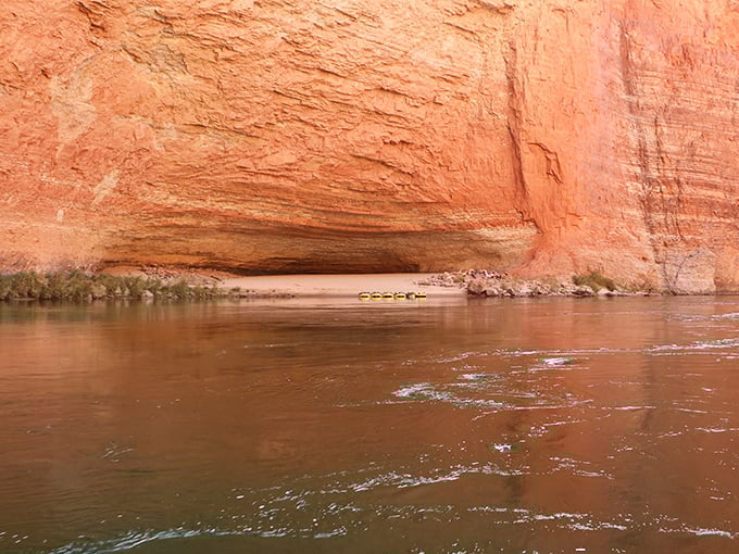 Water-level perspective reveals the canyon's true majesty&mdash;each horizontal line representing thousands of years in Earth's patient diary.