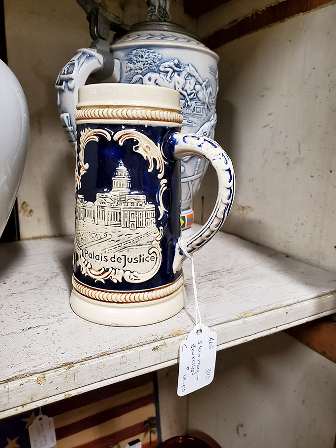 This cobalt blue beer stein depicting the "Palais de Justice" transports you to European caf&eacute;s of yesteryear, its ornate handle waiting for a celebratory toast.