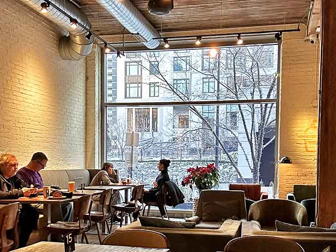 Window seating bathes diners in natural light by day, while offering a cozy nook for intimate conversation as evening falls.
