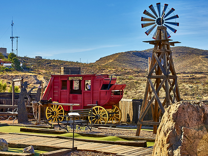 Against the backdrop of Arizona's rugged landscape, this wooden windmill stands sentinel over a town that refused to become just another ghost.