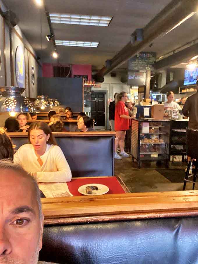 A bustling morning at DK Diner, where strangers become friends united by their shared appreciation for excessive breakfast foods.