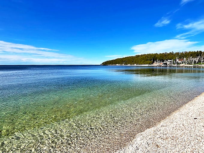 Smooth stones and crystal-clear shallows create a beachcomber's paradise. Time to start your rock collection!