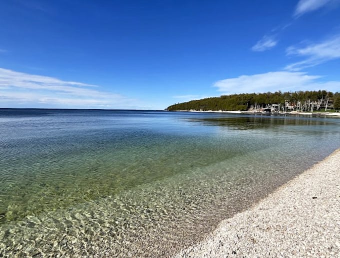 Smooth stones and crystal-clear shallows create a beachcomber's paradise. Time to start your rock collection!