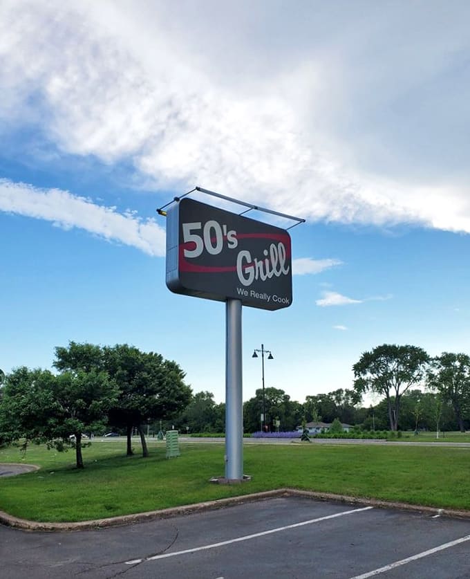 That sign towers over the parking lot like a beacon calling hungry travelers to their happy place.