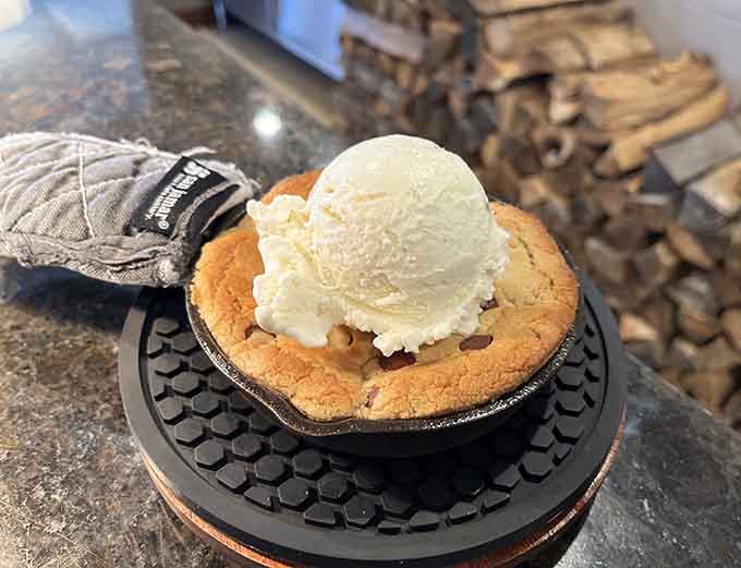 Warm chocolate chip cookie meets cold vanilla ice cream in a dessert that'll make you reconsider your "too full" claims.