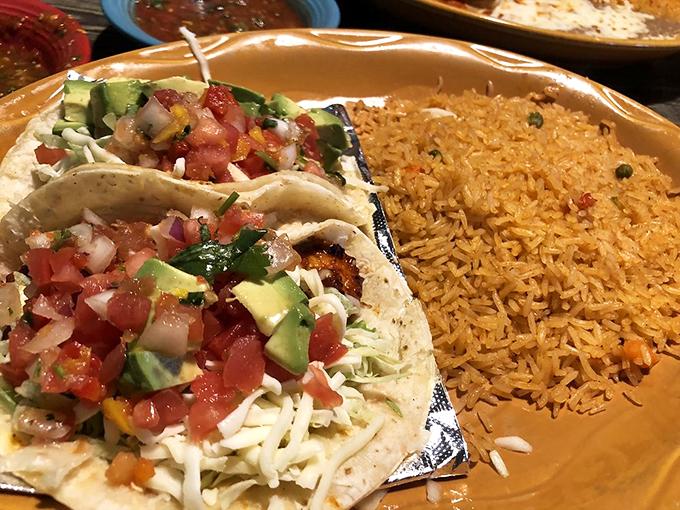 Fresh shrimp tacos with crisp vegetables and creamy sauce - like a beach vacation wrapped in a warm tortilla.