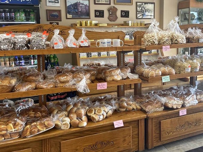 Bread, rolls, and packaged treats line wooden shelves like soldiers of satisfaction, ready to march home with hungry customers.
