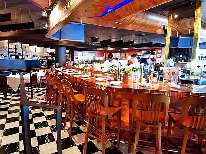 The heart of culinary action &ndash; Joe Muer's copper-topped bar where mixologists craft liquid magic and chefs prepare fresh delicacies.